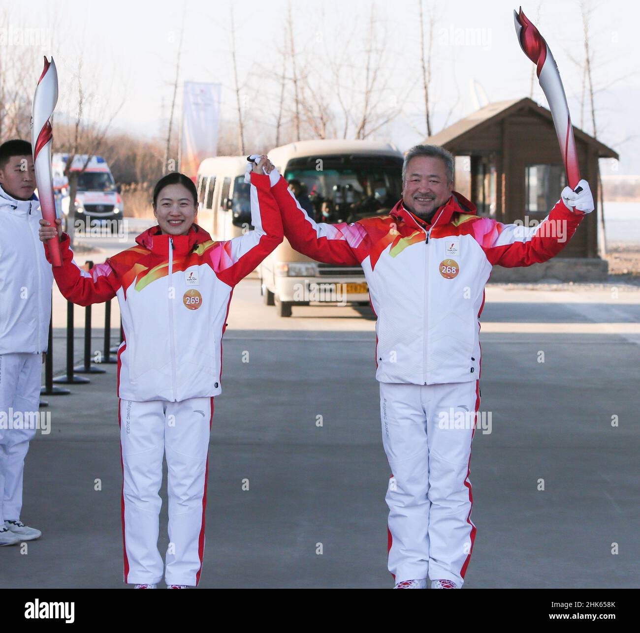 Beijing, China. 2nd Feb, 2022. Torch bearers Fan Jun (R) and Fan Yiting ...