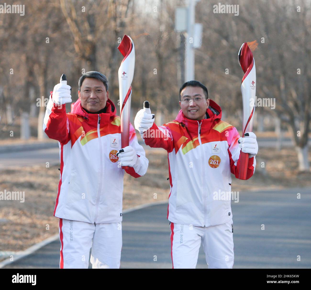 Beijing, China. 2nd Feb, 2022. Torch bearers Chen Zong (L) and Chen ...