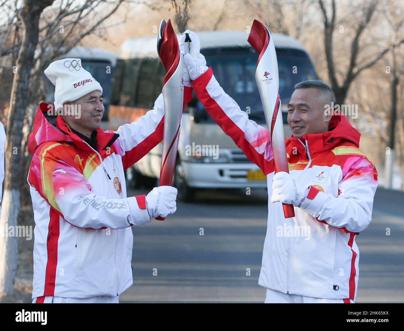 Beijing, China. 2nd Feb, 2022. Torch bearers Dong Rui (L) and Cui Jie ...