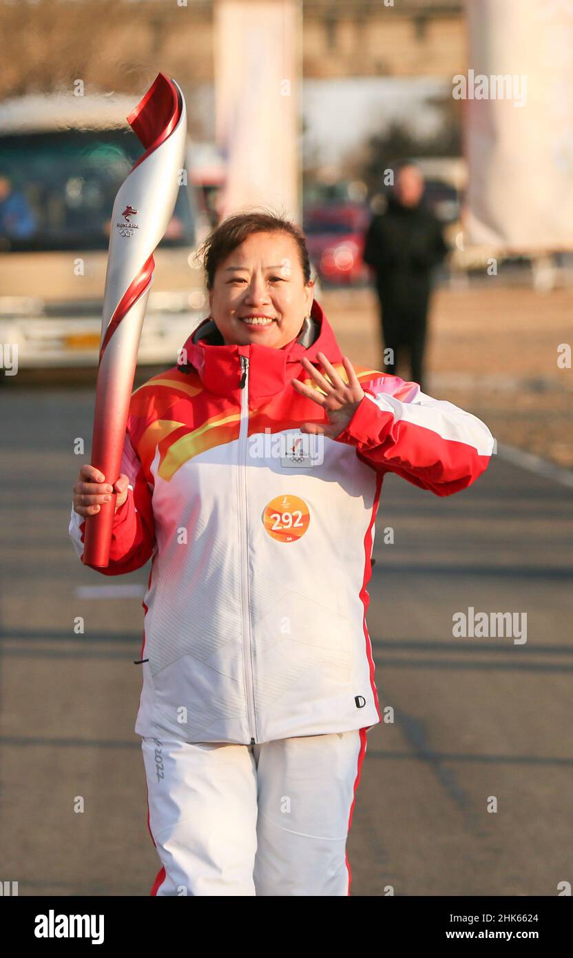 Beijing, China. 2nd Feb, 2022. Torch bearer Li Ping runs with the torch during the Beijing 2022 ...