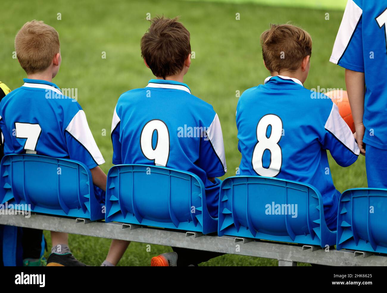 Boys in Blue Soccer Shirts Sitting on Bench. Substitute Sports Players ...