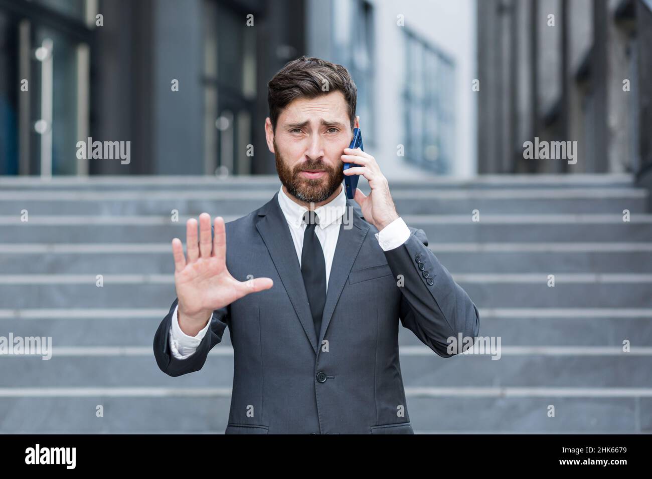 portrait successful young confident businessman talking background ...