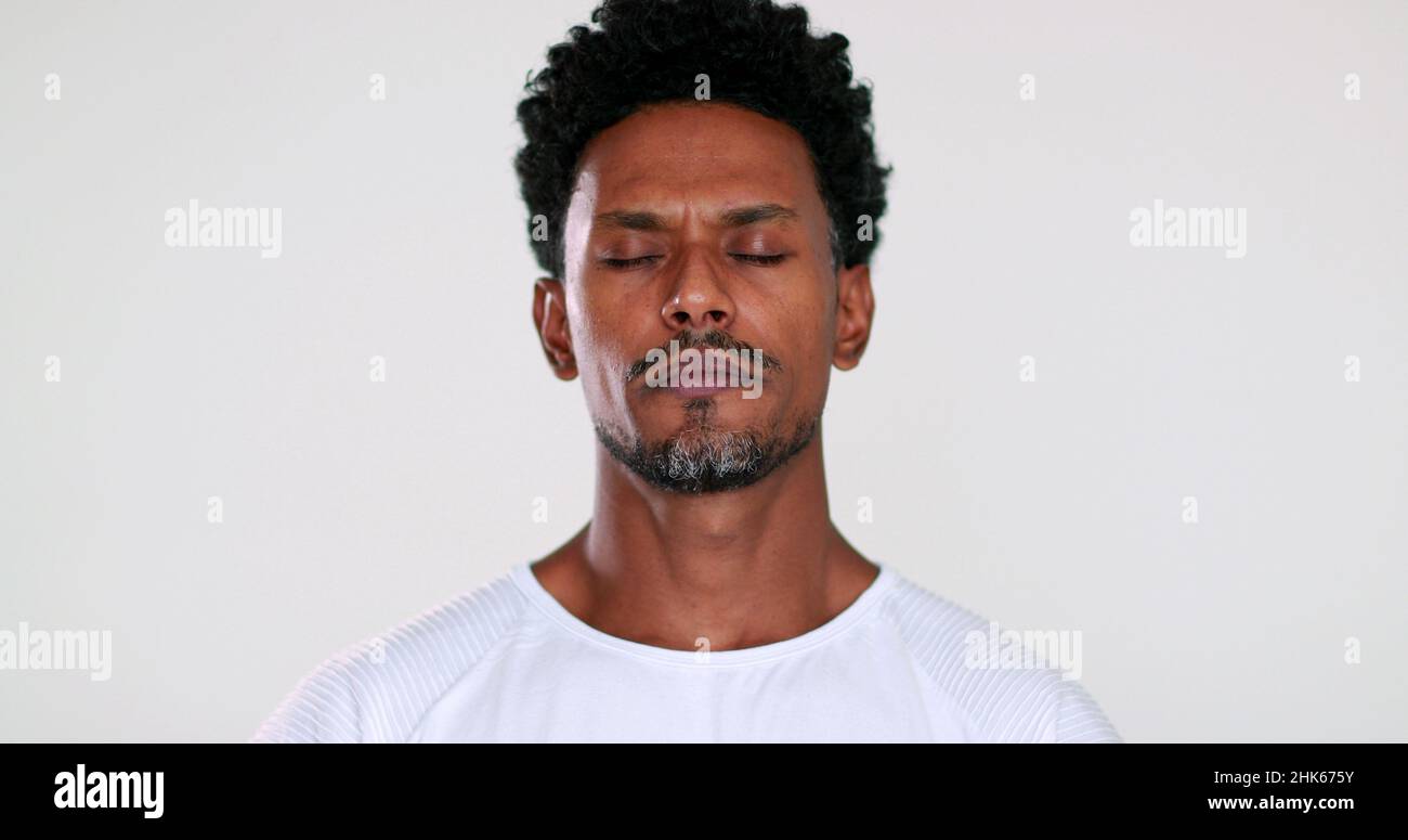 African man closing in meditation hi-res stock photography and images ...