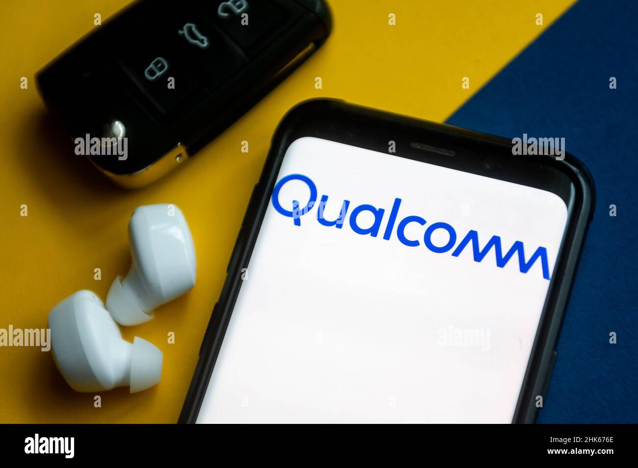 In this photo illustration a Qualcomm logo seen displayed on a ...