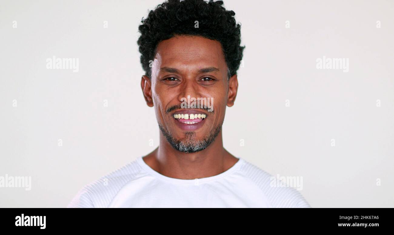 African man feeling pain relief and smiling again Stock Photo - Alamy