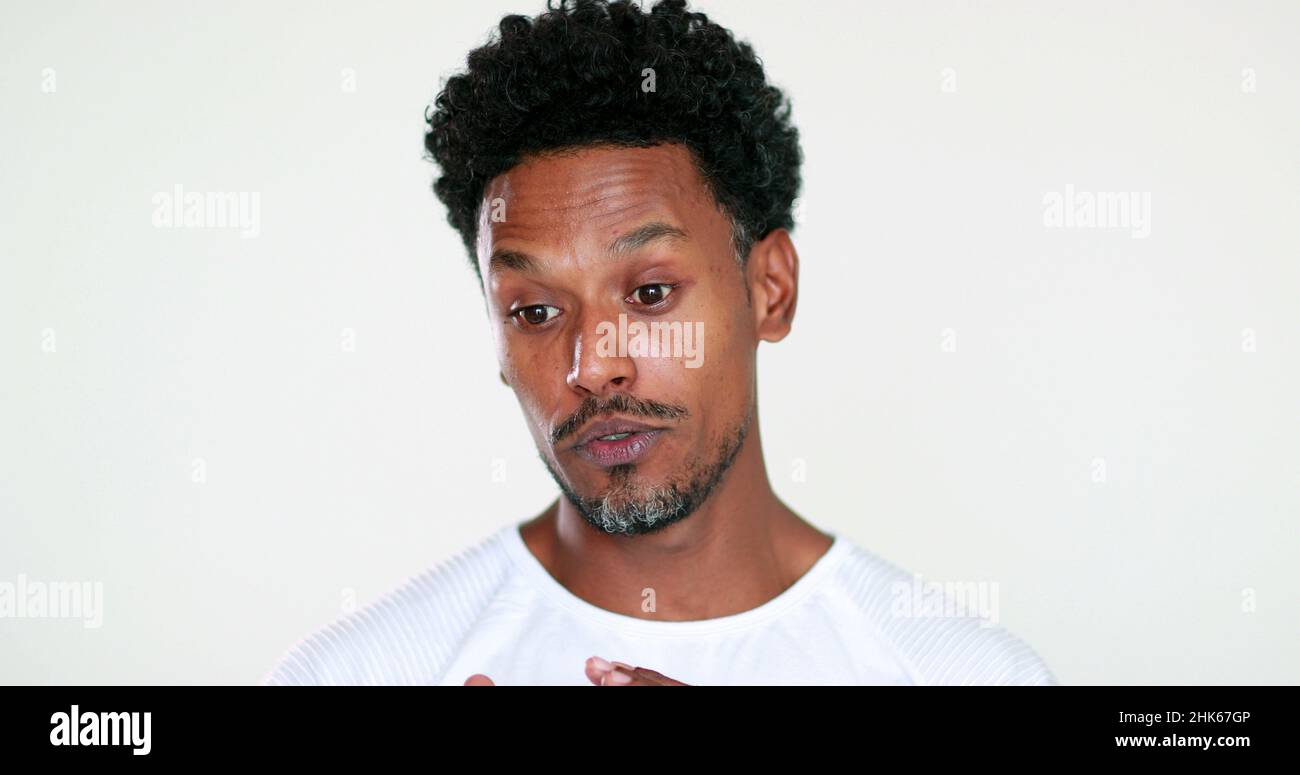African man speaking to camera giving testimony Stock Photo - Alamy