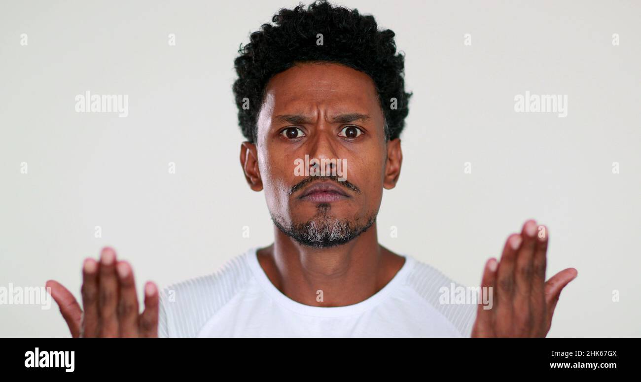 African man shock emotional reaction, upset angry black person, are you crazy puzzled Stock ...