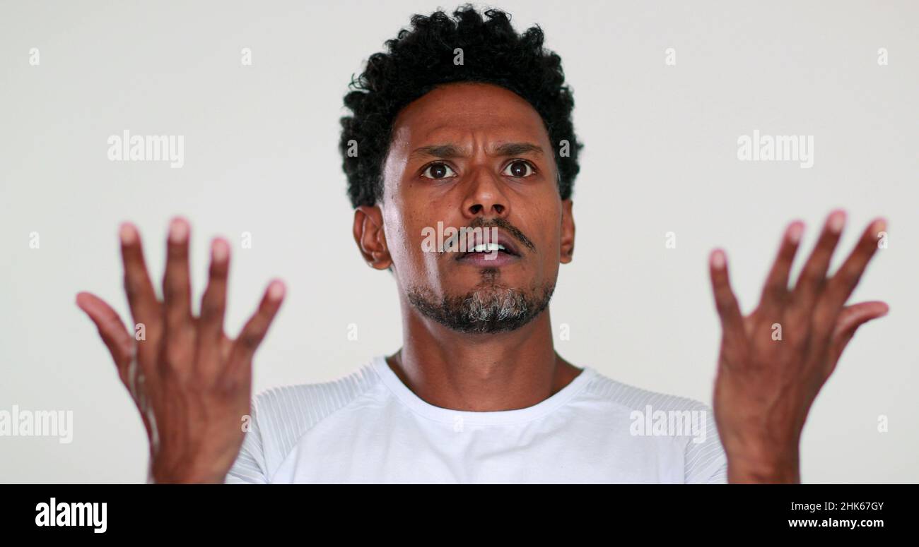African man shock emotional reaction, upset angry black person, are you crazy puzzled Stock ...