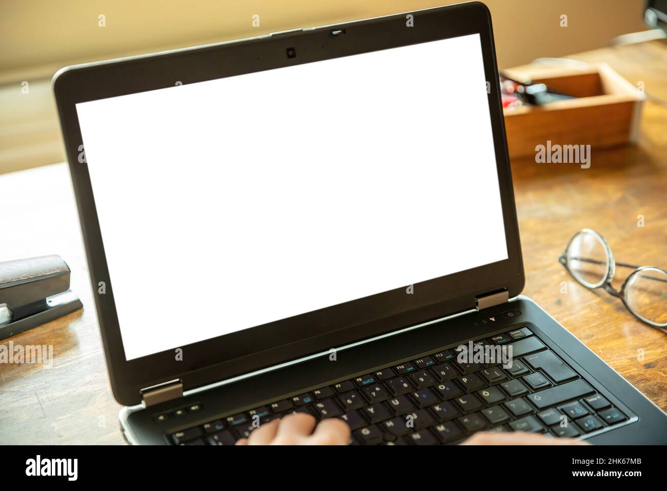 Blank screen laptop computer, home office work. Man type, open notebook ...