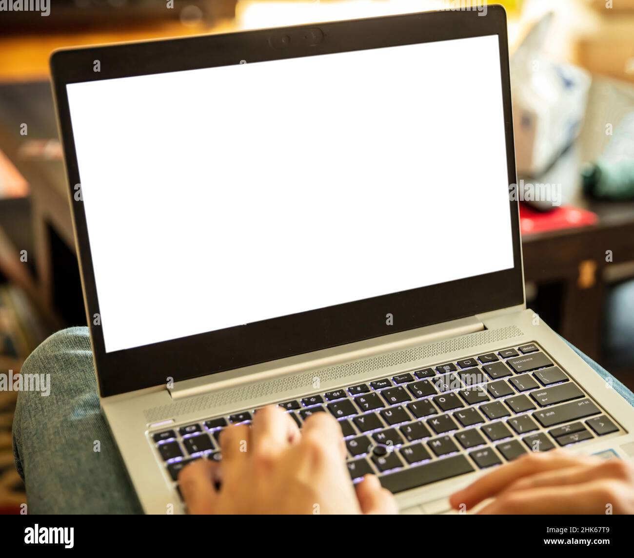 Home office work. Empty blank screen, male hand typing on a laptop ...