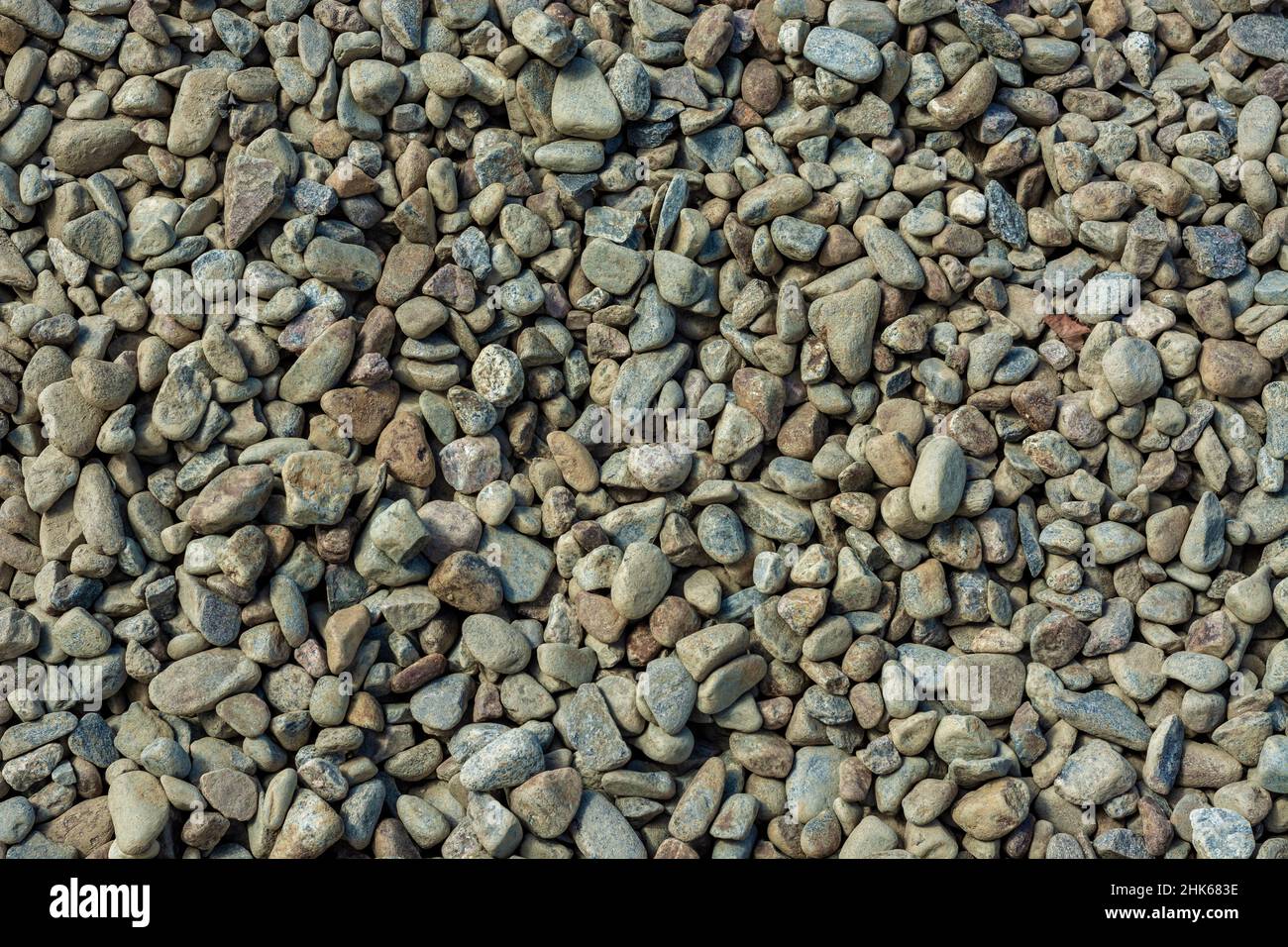 Fragment of the surface of small gray stones for use as an abstract ...