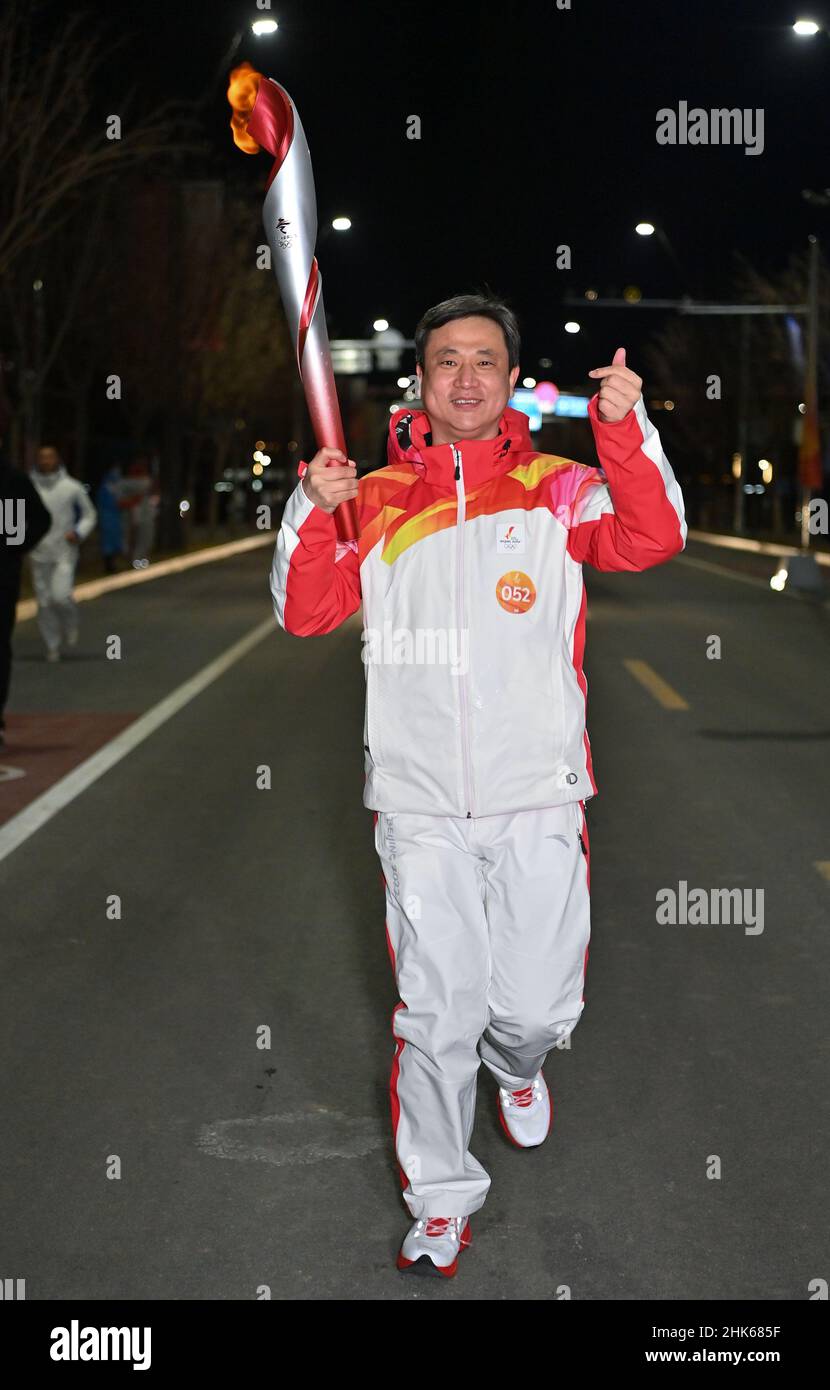 Beijing, China. 2nd Feb, 2022. Torch bearer Pang Bo runs with the torch during the Beijing 2022 ...