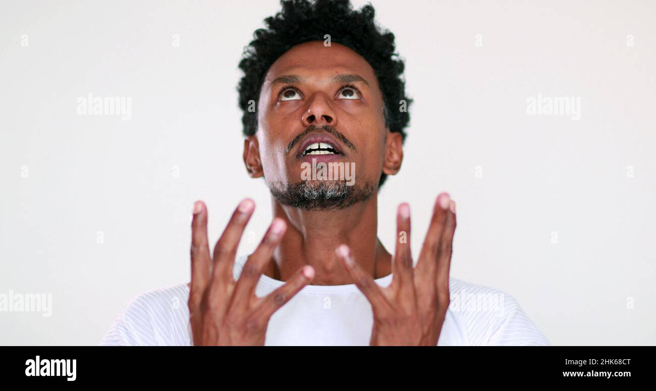Frustrated anxious african man portrait emotional reaction, looking at ...