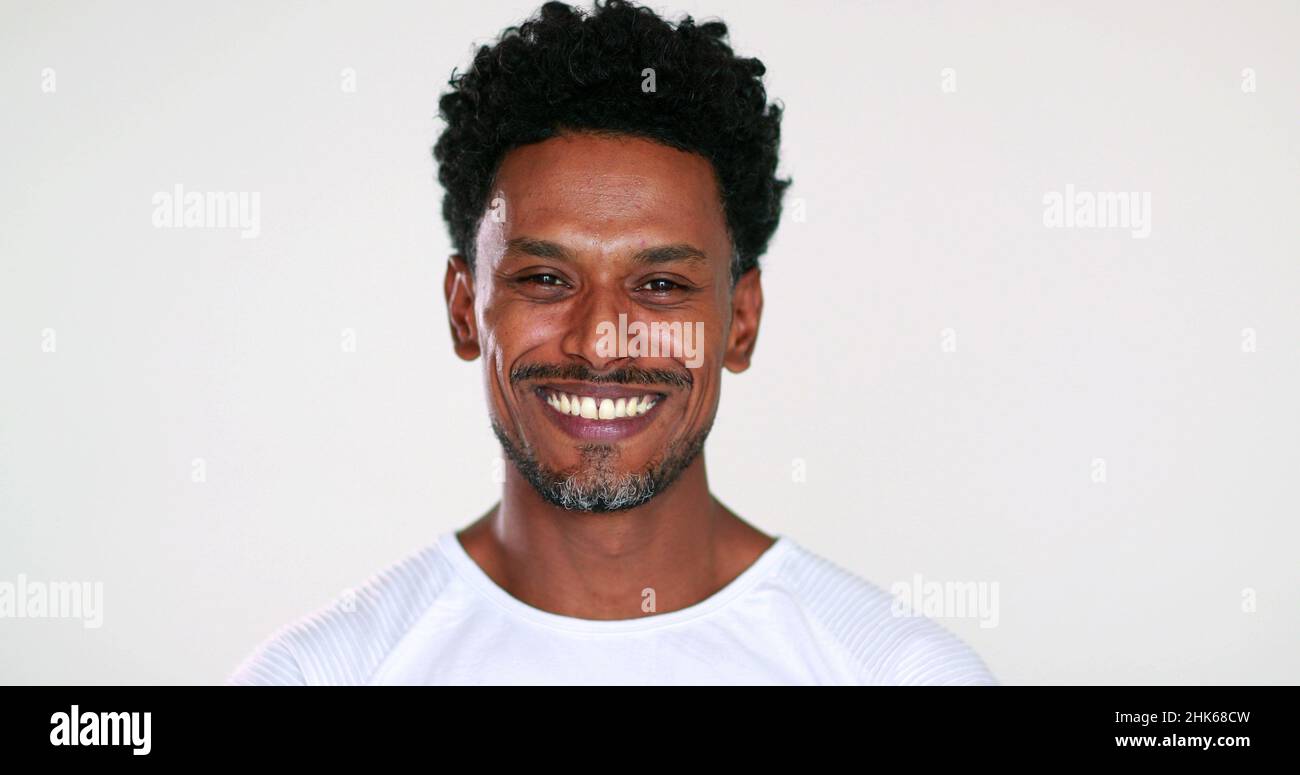 Compassionate black African man smiling camera giving thanks an d being ...
