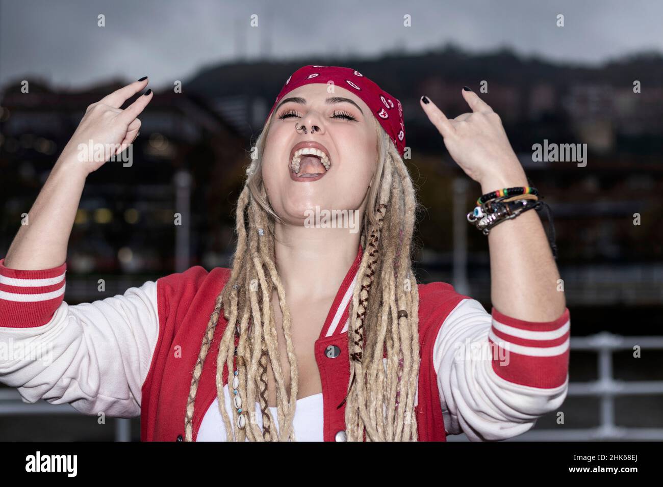 blonde woman with dreadlocks screaming and cheating Stock Photo - Alamy