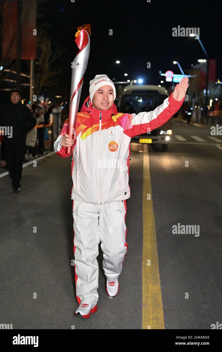 Beijing, China. 2nd Feb, 2022. Torch bearer Guo Lianghui runs with the torch during the Beijing ...