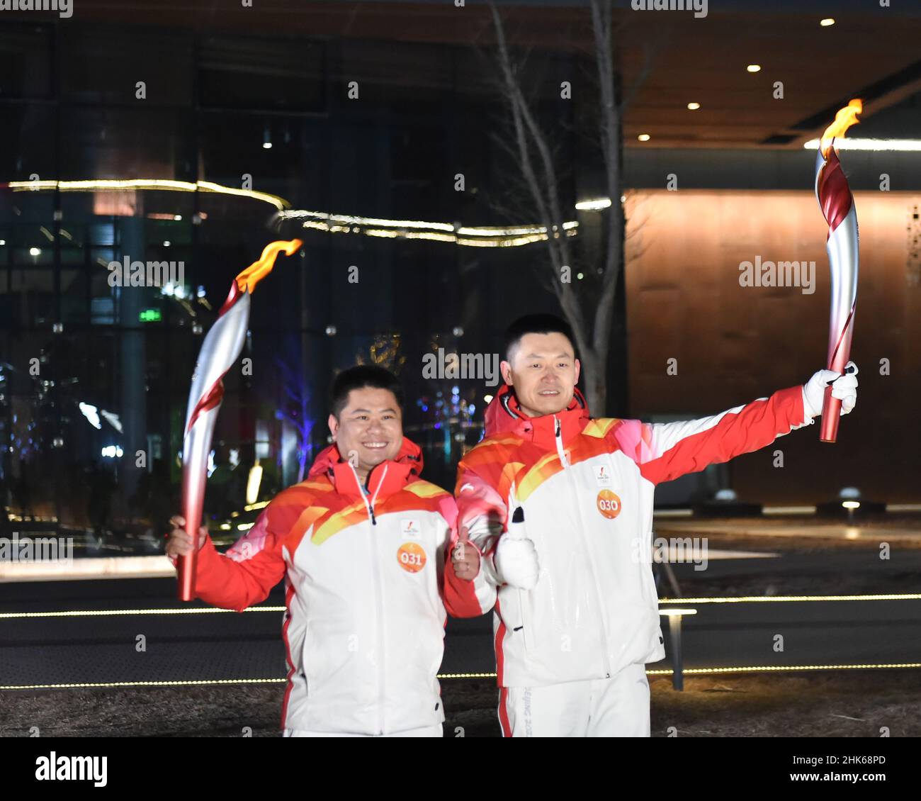Beijing, China. 2nd Feb, 2022. Torch bearers Huang Yixiang (R) and Li ...