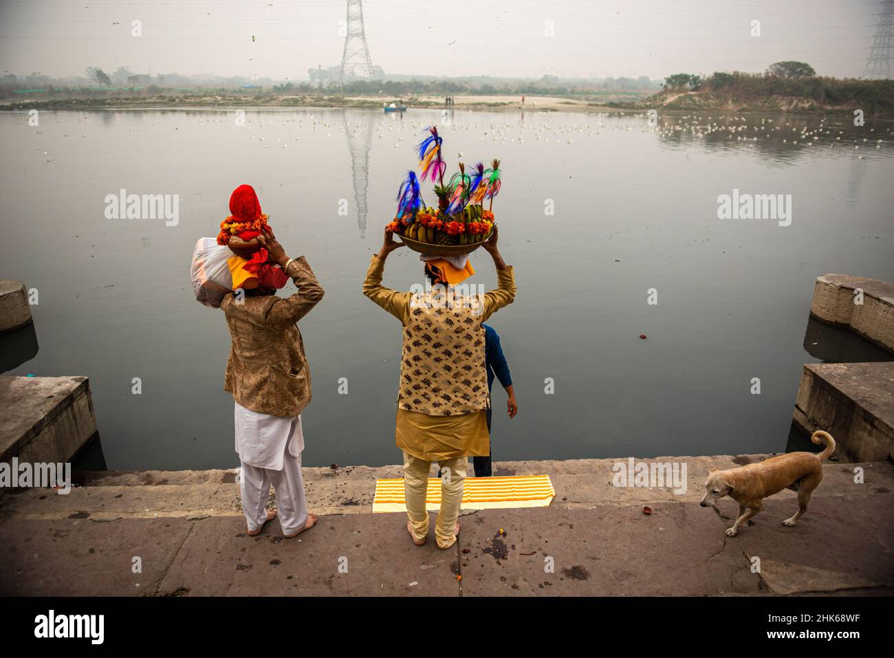 Sindhi priests seen carrying a basket of fruits and decorated flowers ...