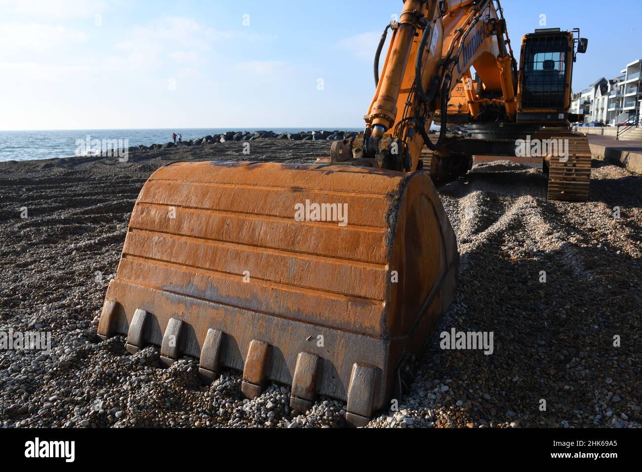 Digger on the beach Stock Photo - Alamy