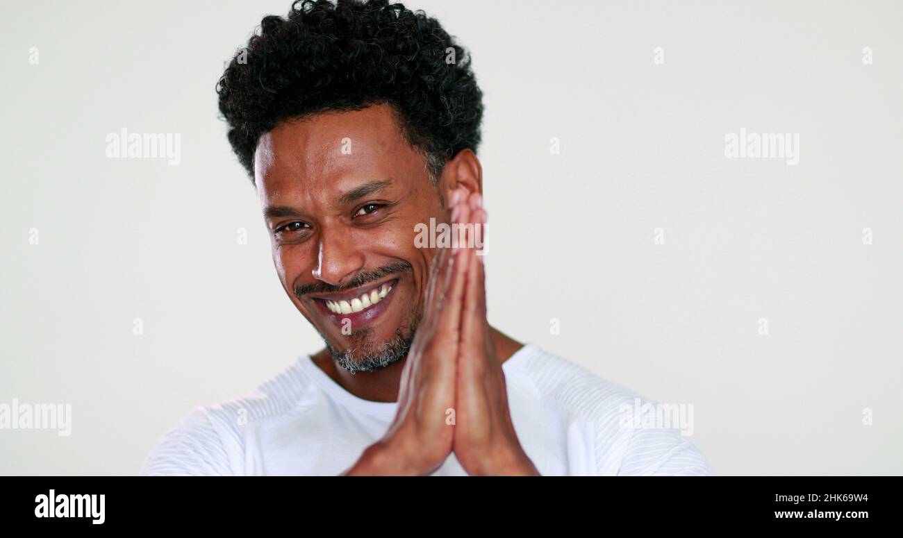 Spiritual African man portrait smiling worshiping with faith and hope ...