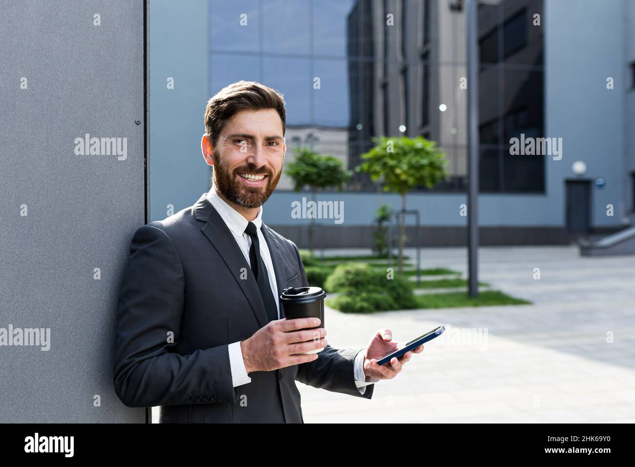 Successful businessman broker in a business suit talking on the phone ...