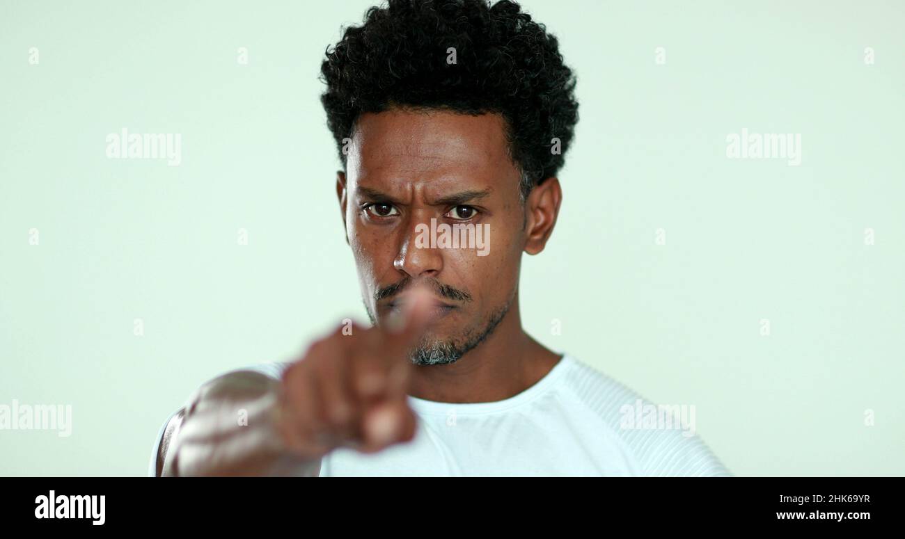 Upset African man pointing finger arguing. Black man in argument ...