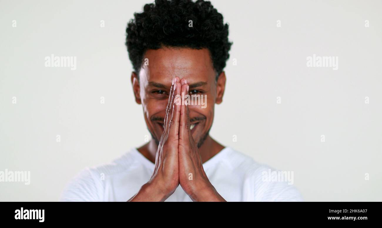 Spiritual African man portrait smiling worshiping with faith and hope ...
