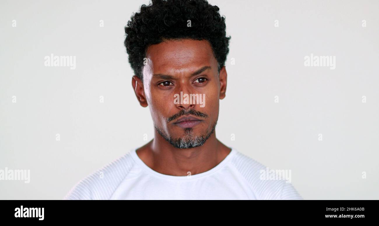 Upset African black man feeling regret and anxiety Stock Photo - Alamy
