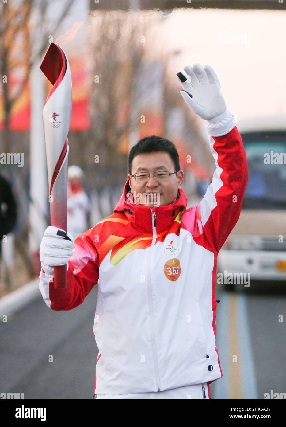 Beijing, China. 2nd Feb, 2022. Torch bearer Yang Zhi runs with the torch during the Beijing 2022 ...