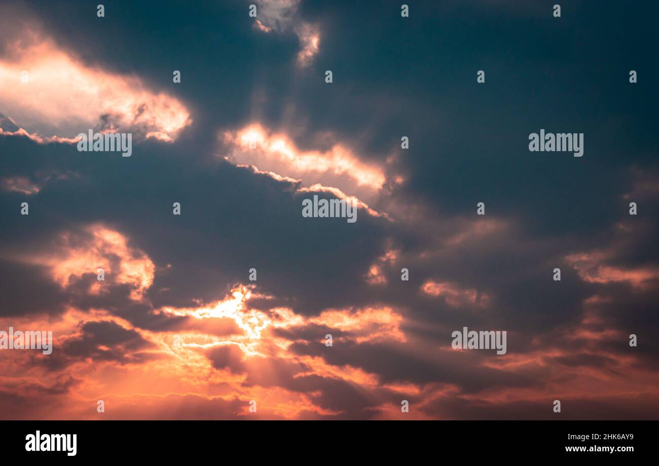 dramatic orange sky with bleeding sun rays at dawn image is taken at ...