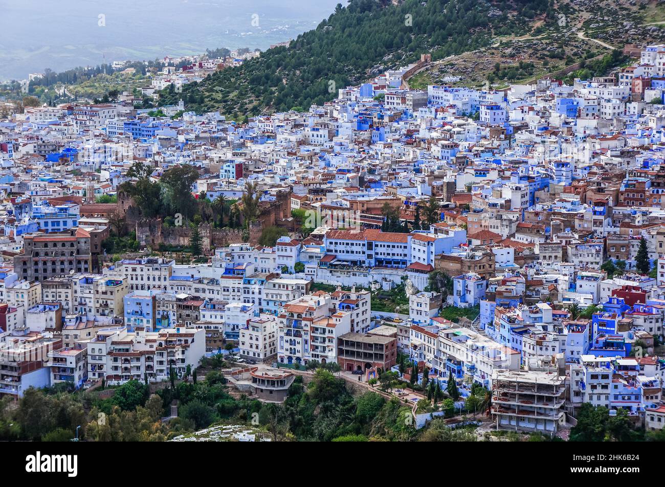 wide high angle view of Chefchaouen town with it's buildings painted in ...
