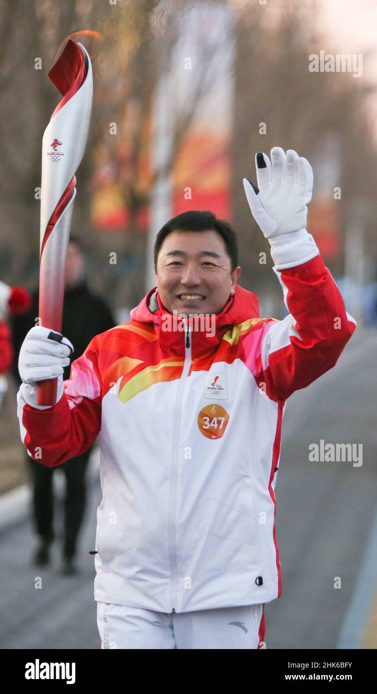 Beijing, China. 2nd Feb, 2022. Torch bearer Yang Ling runs with the torch during the Beijing ...