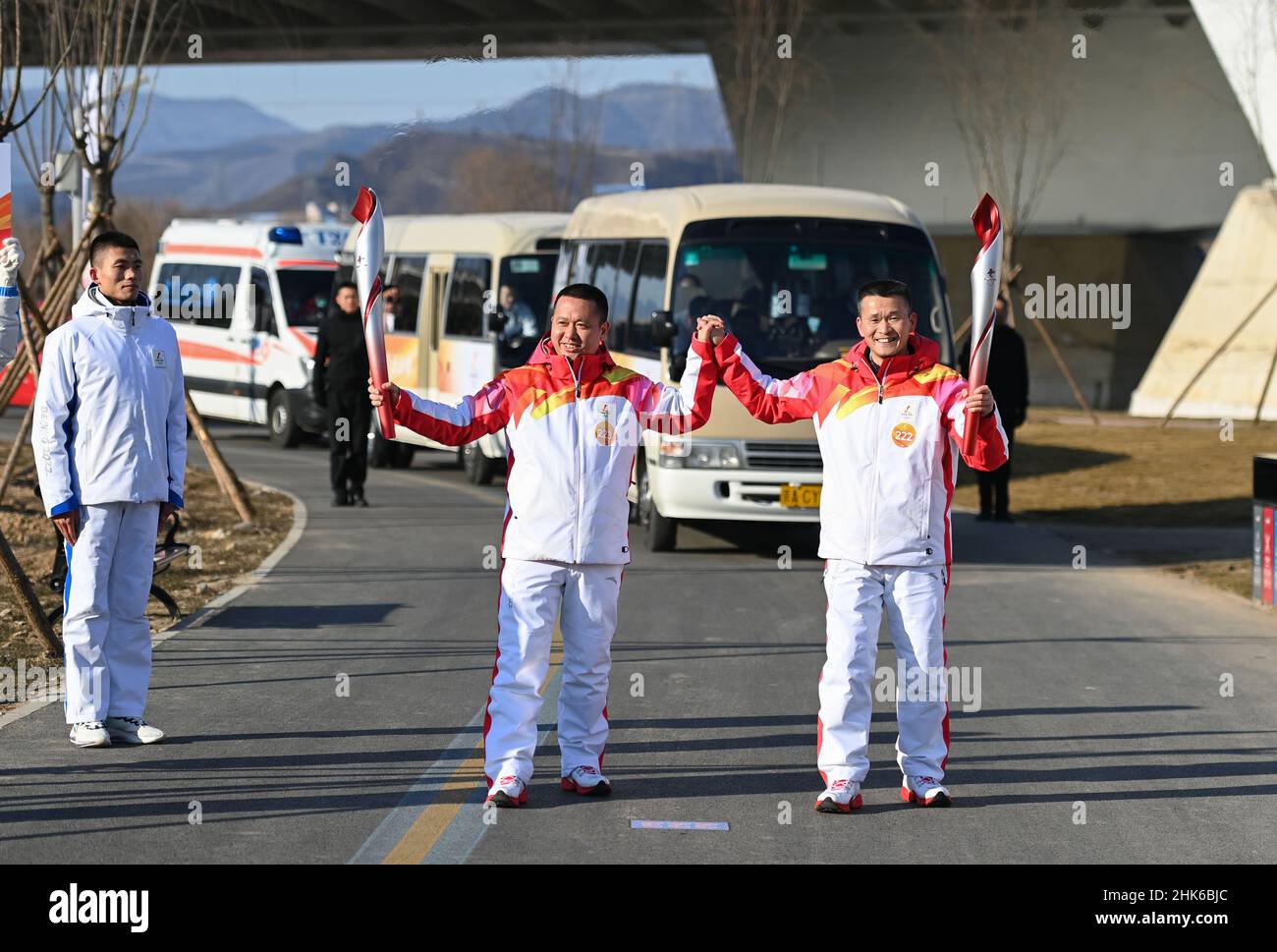 Beijing, China. 2nd Feb, 2022. Torch bearers Peng Huasheng (L) and Cai ...