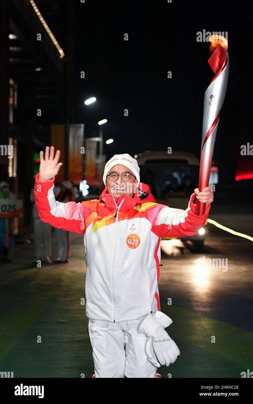 Beijing, China. 2nd Feb, 2022. Torch bearer Yin Weidong runs with the torch during the Beijing ...