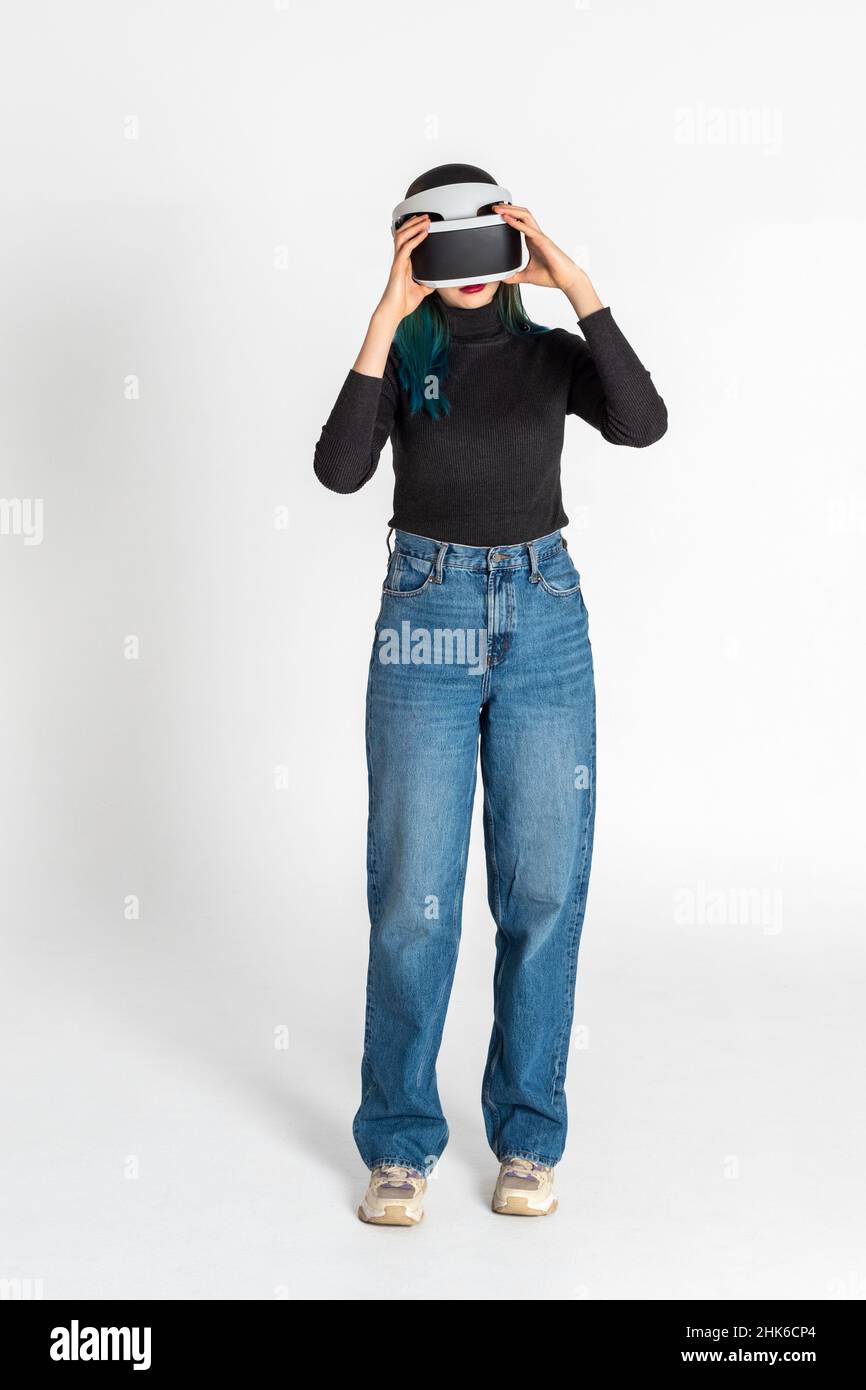 Teen girl using vr headset is in virtual reality cyberspace futuristic ...