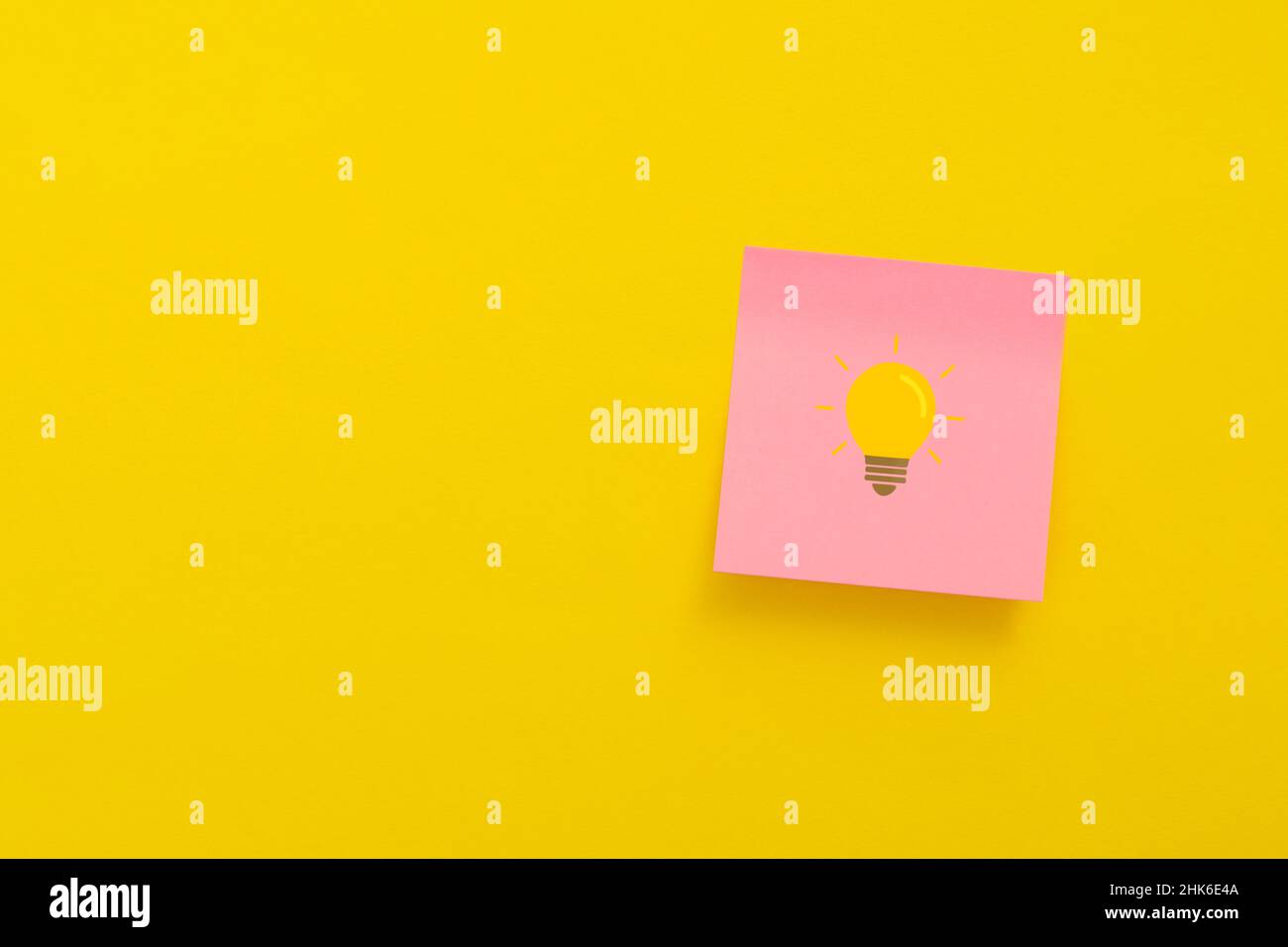 Light bulb on sticky notes on yellow background. Inspiration and ...