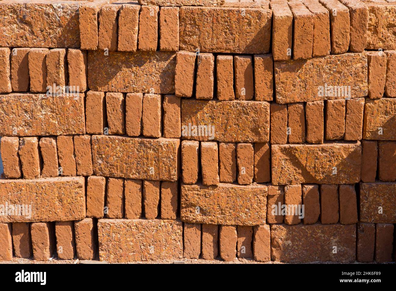 Red brick wall made of stone, Brick wall background Stock Photo - Alamy
