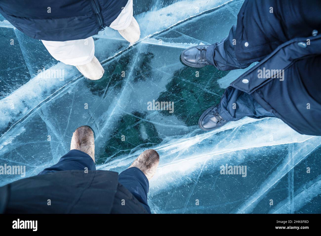 Low section of people standing on the ice Stock Photo - Alamy