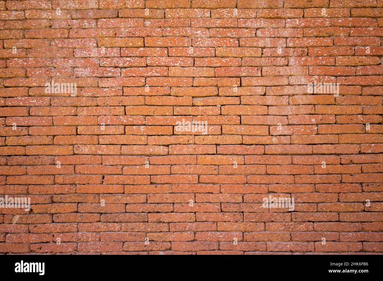 Red brick wall made of stone, Brick wall background Stock Photo - Alamy