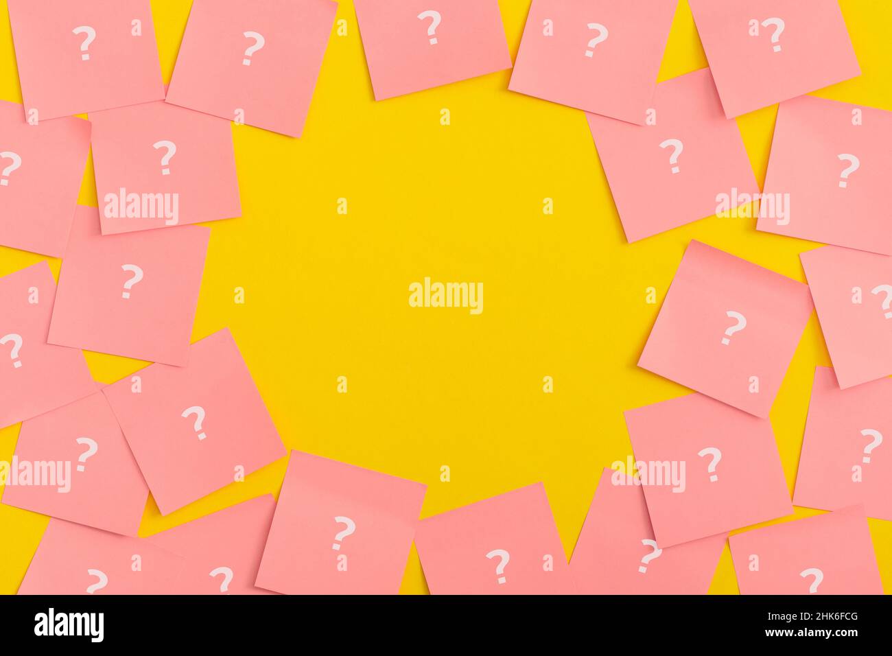 Sticky notes on yellow background. Question mark Stock Photo - Alamy