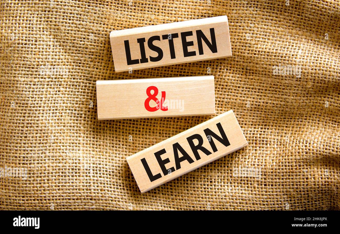 Listen and learn symbol. Concept words Listen and learn on wooden ...