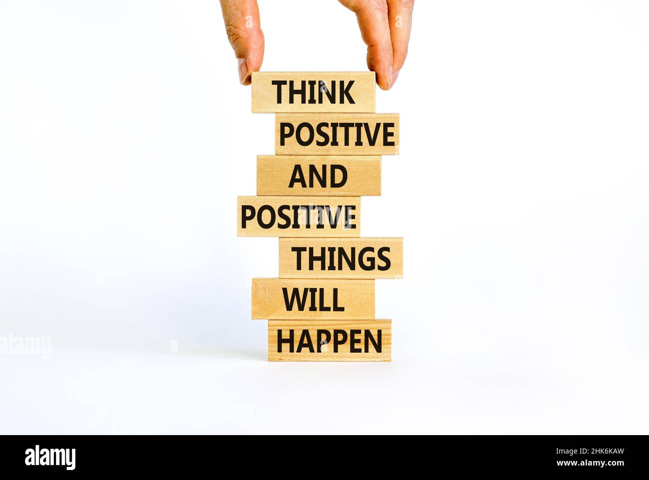 Think positive symbol. Wooden blocks with words Think positive and ...