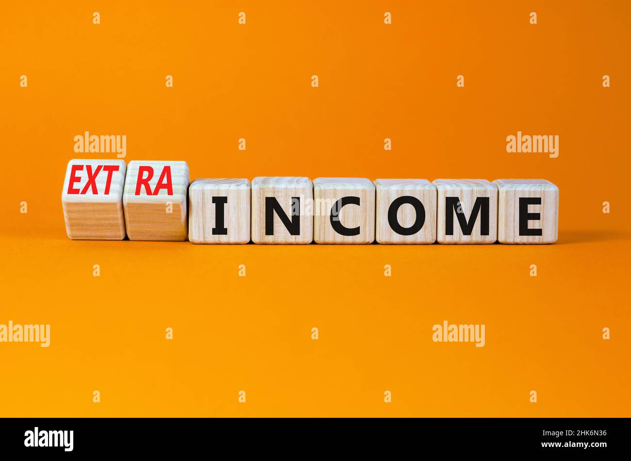 Extra income symbol. Turned wooden cubes and changed concept words ...