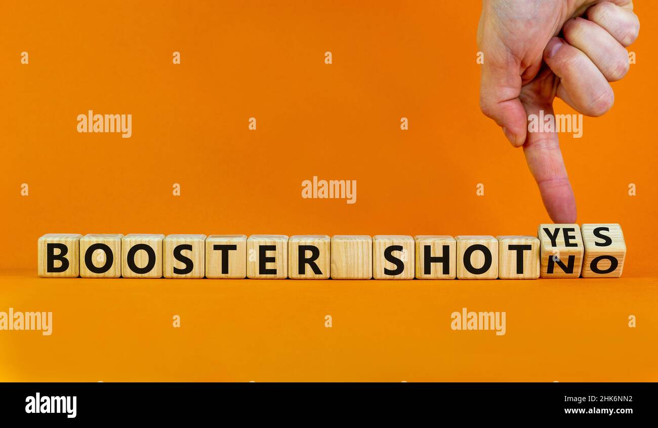 Covid-19 booster vaccine shot yes or no symbol. Doctor turns cubes and ...
