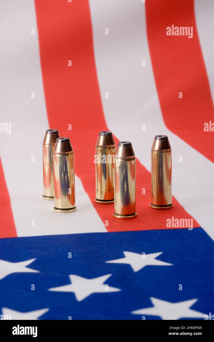 Group of bullets standing on American flag Stock Photo - Alamy