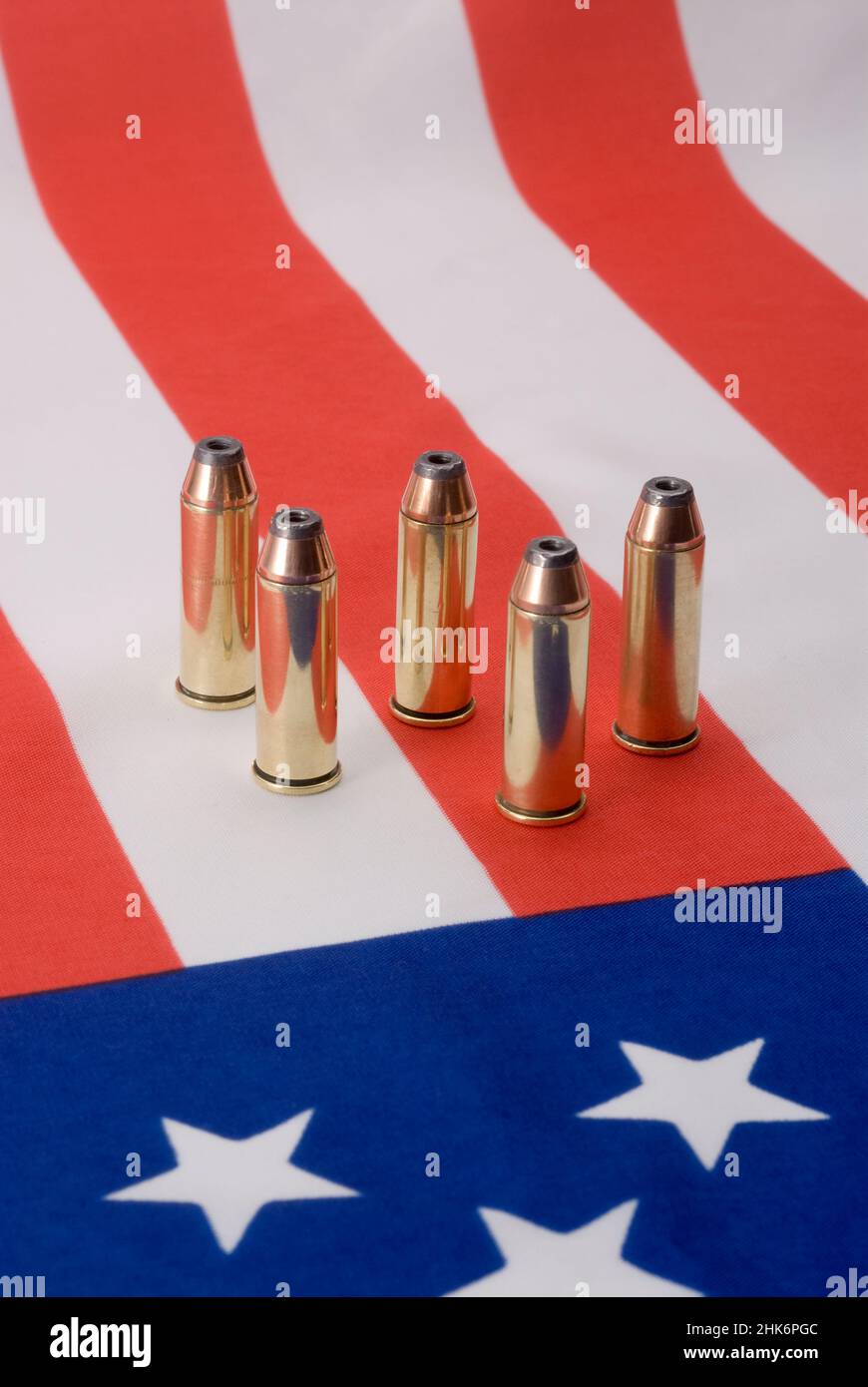 Group of bullets standing on American flag Stock Photo - Alamy