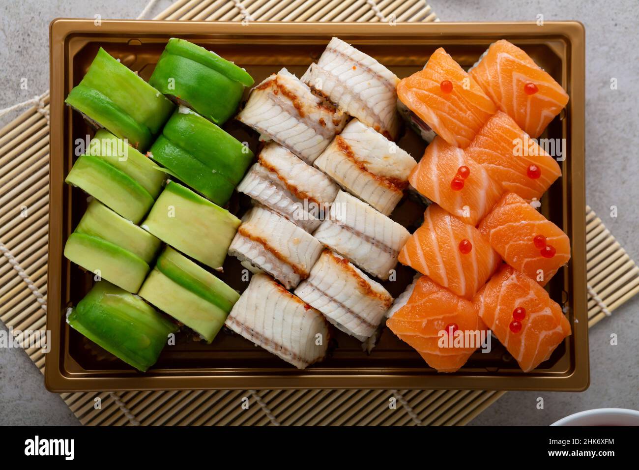Overhead view of sushi rolls in take away tray Stock Photo - Alamy