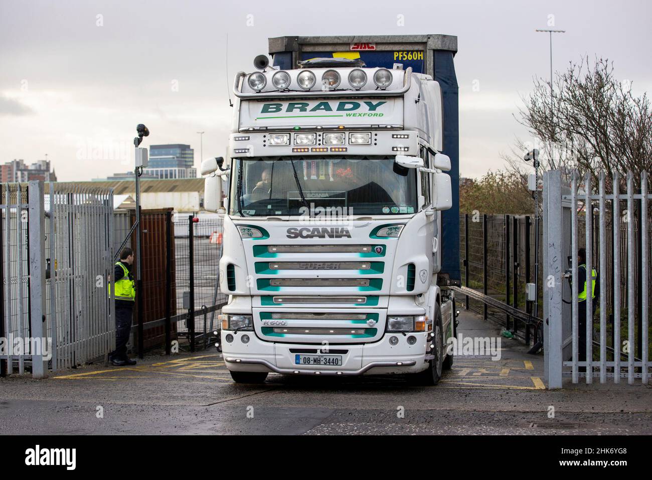 UK Border Force officers watch on as lorry drives out of the NI ...