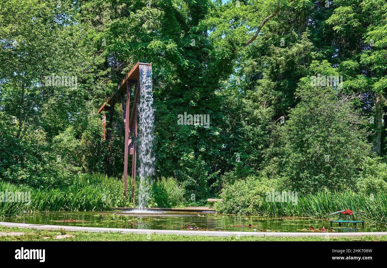 A serene,tranquil waterfalls in a Heritage Gardens. With water coming ...
