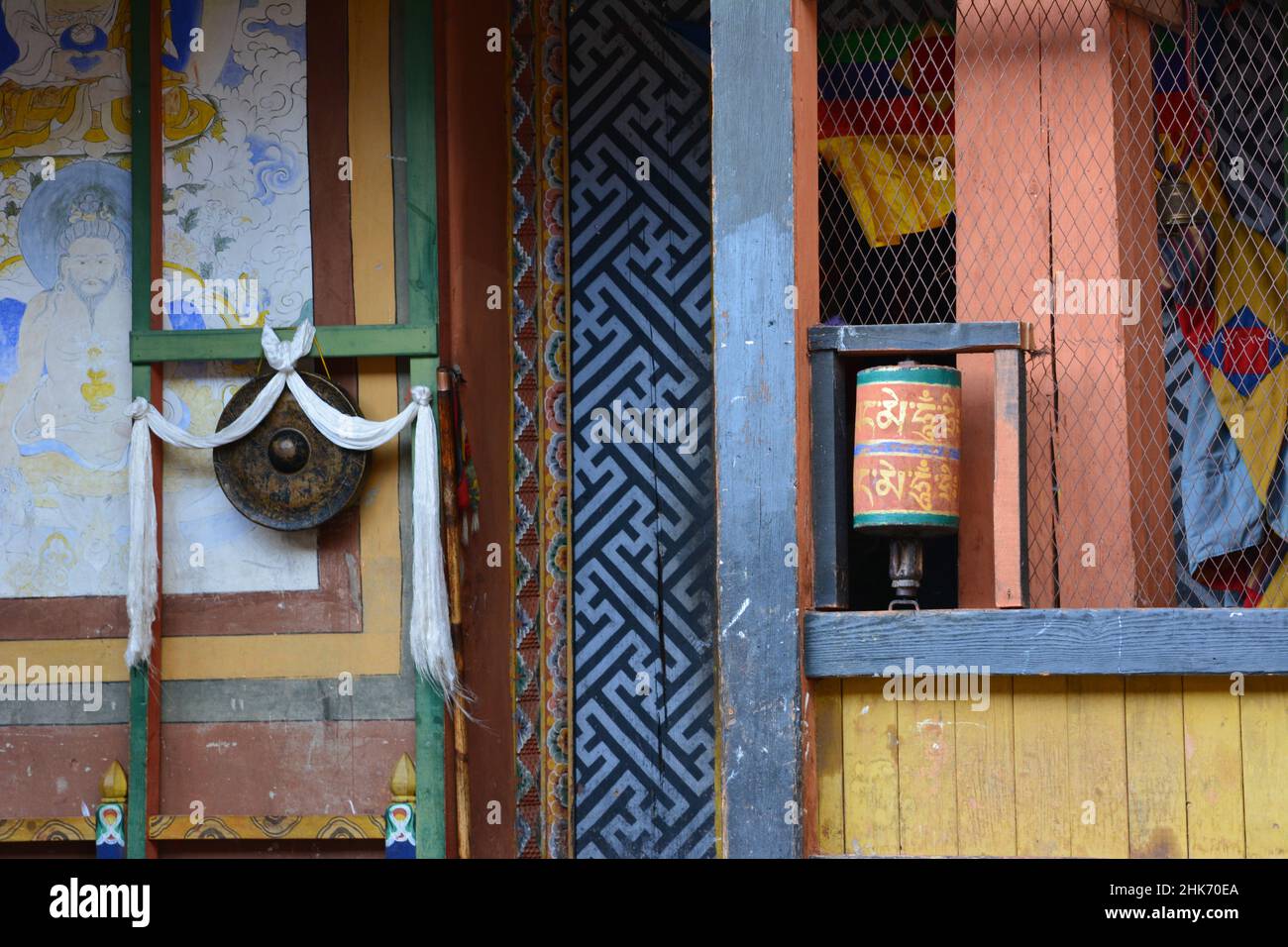 Bhutan - nice scene in a city with a facade having a traditional gong ...